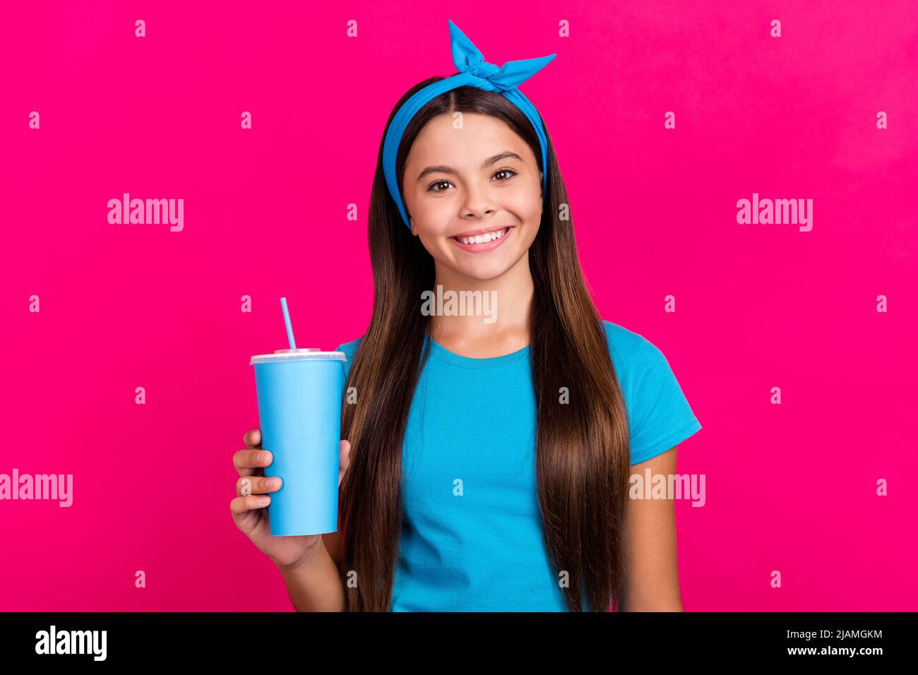 Portrait of attractive cheerful long-haired girl drinking cocktail ...