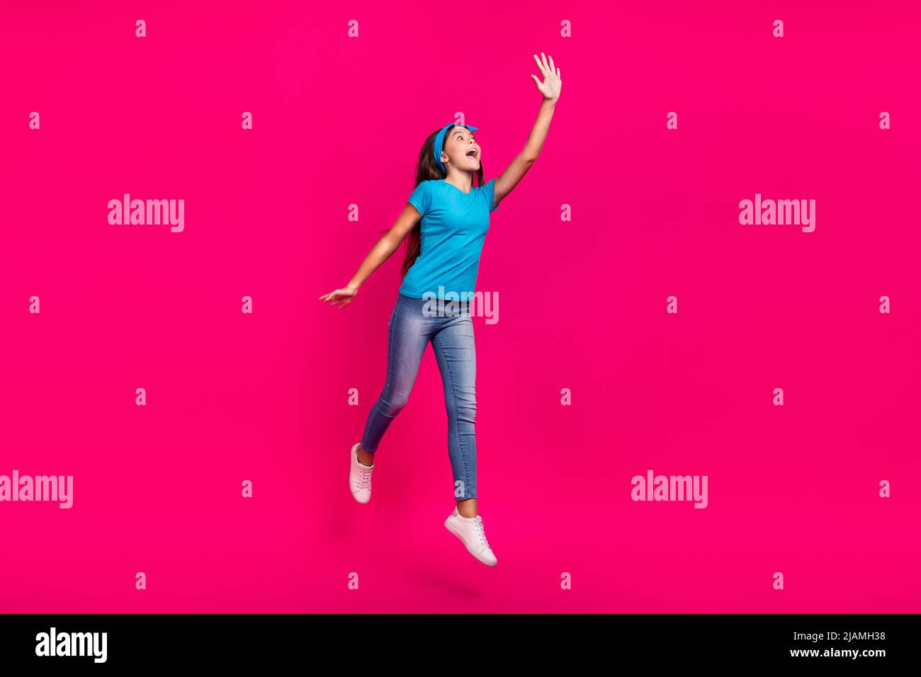 Full length body size view of attractive cheerful girl jumping waving ...