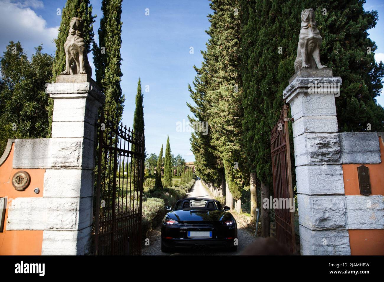 View through the gate to the Italian villa Stock Photo - Alamy