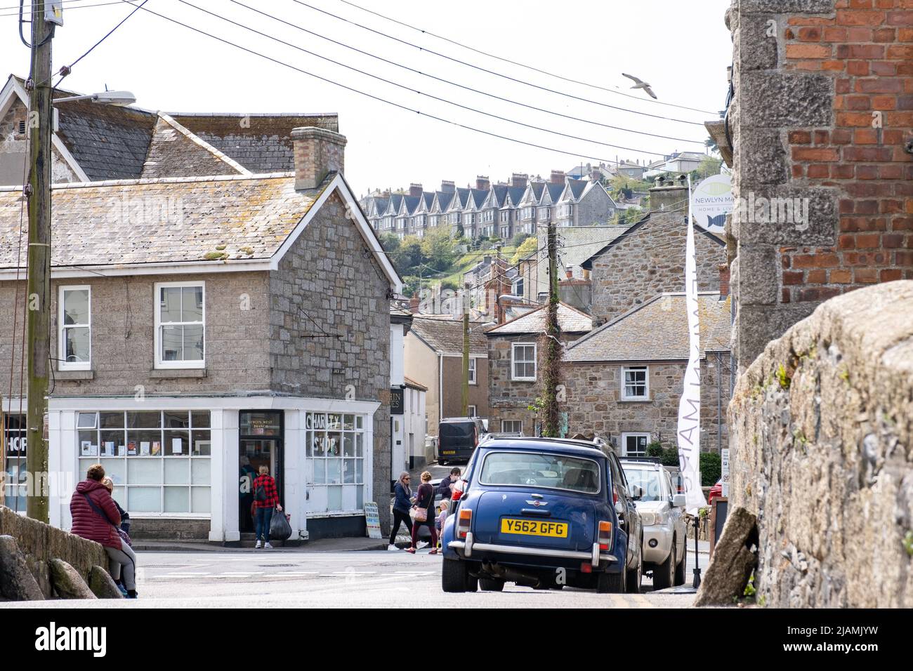 Street scene in the fishing village of Newlyn. Featuring an early mini ...