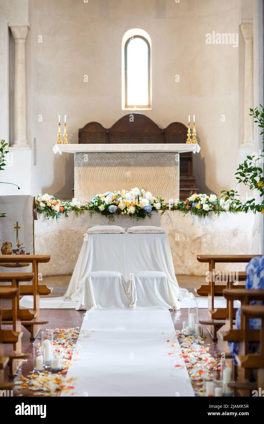 Altar in the church after a wedding ceremony Stock Photo - Alamy