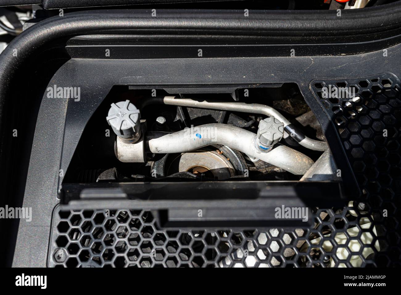 Aluminum air conditioning tubes with a cap, located in the diesel ...