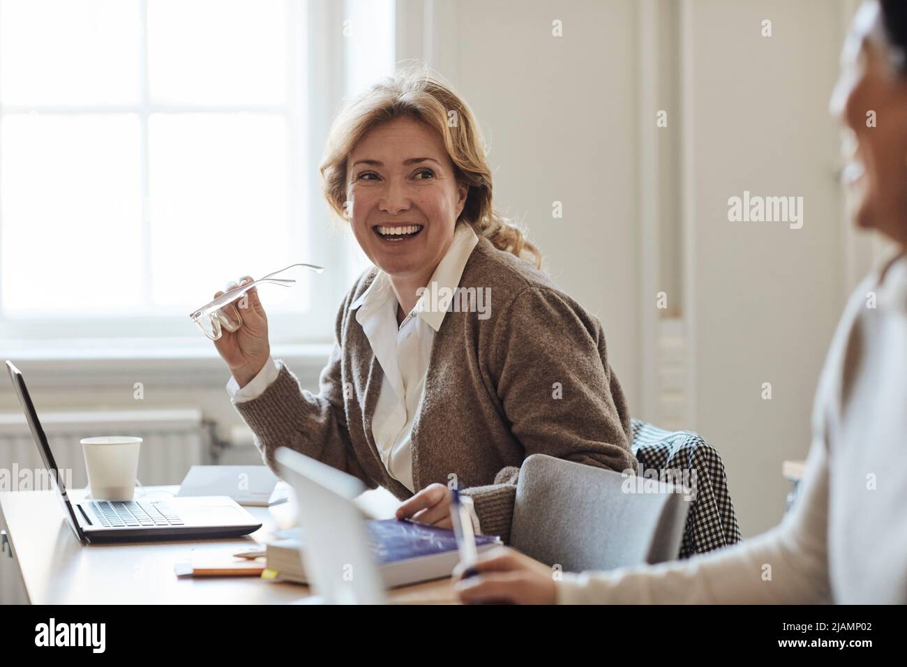 Positive mature female teacher hi-res stock photography and images - Alamy