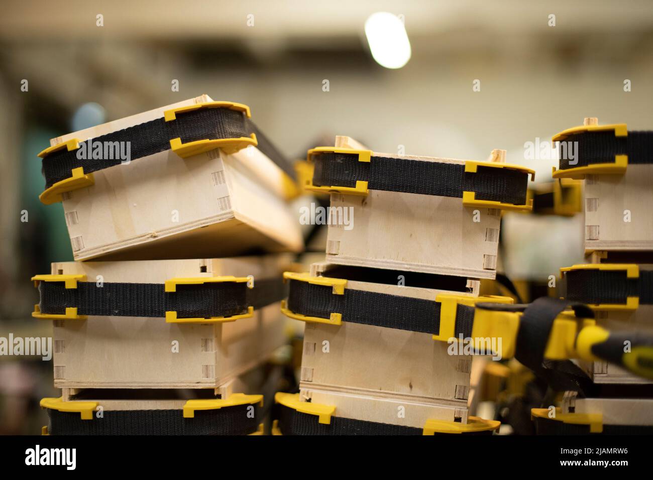 Tightening boards. Tool for fixing parts. Straps are black. Wooden boxes are glued together ...