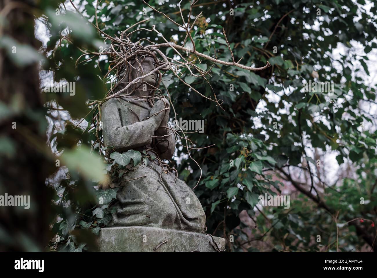 Statue of Praying Jesus on Old European Cemetery Stock Photo - Alamy