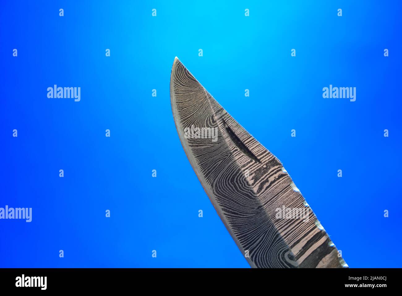 hand-forged knife made of several layers of steel with an exclusive ...