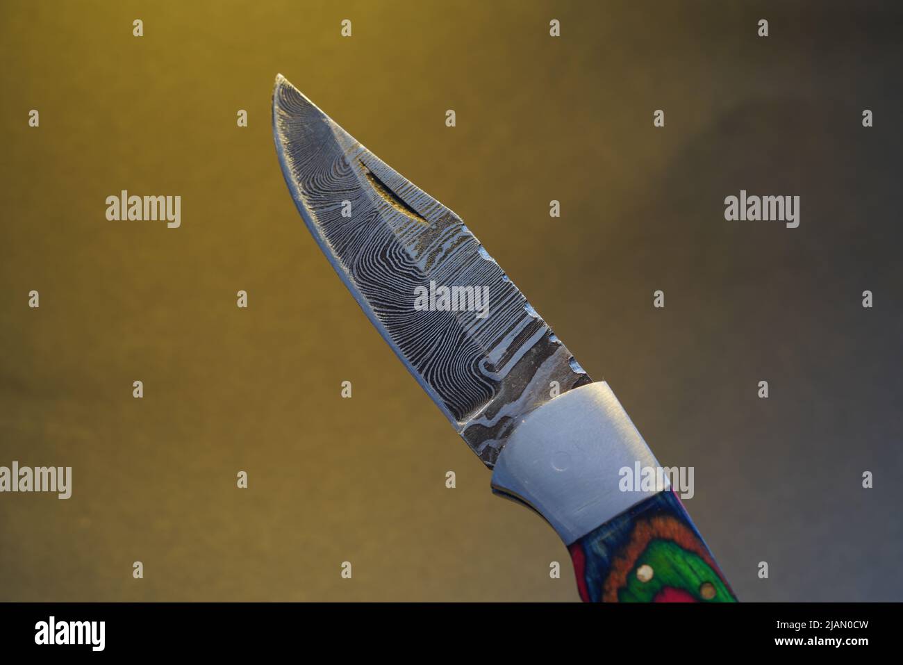 hand-forged knife made of several layers of steel with an exclusive ...