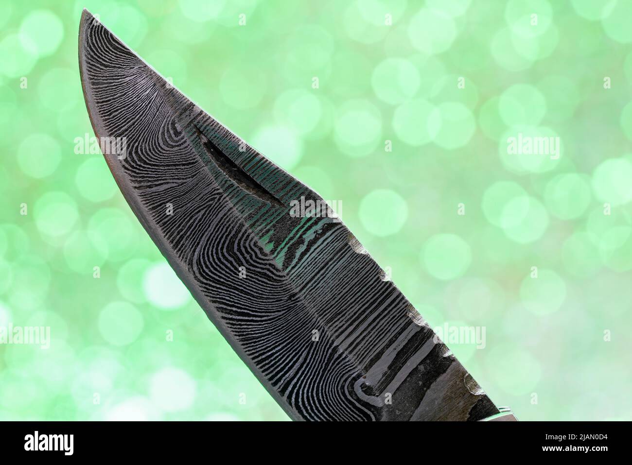 hand-forged knife made of several layers of steel with an exclusive ...