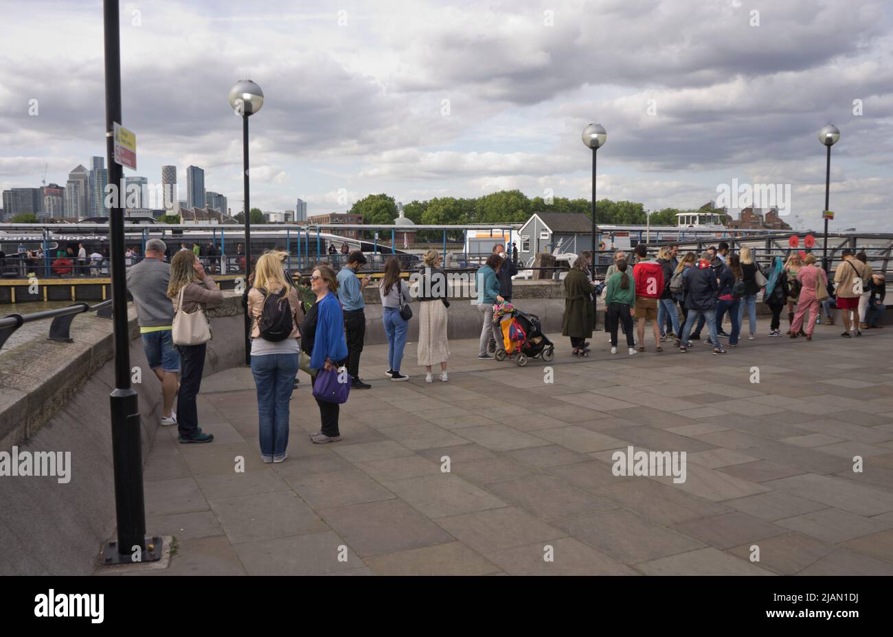 Visitors to Greenwich by Royal Observatory in line to travel by ferry ...