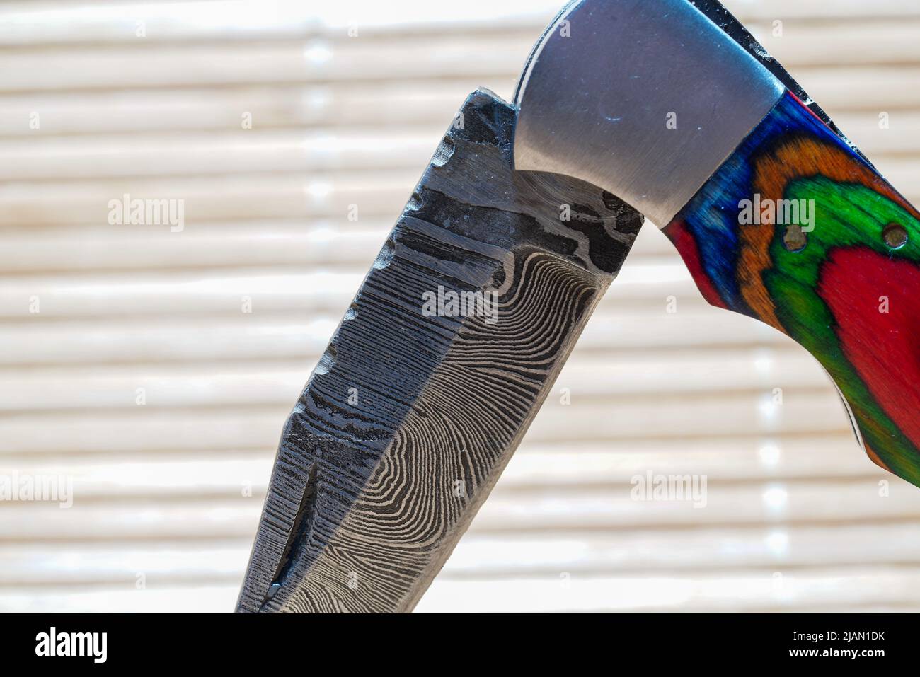 Damask hand-forged knife made of several layers of steel with an ...