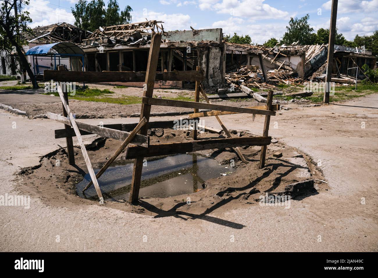 War in Ukraine. Crater from an explosion in the Sumy region. Russia's ...
