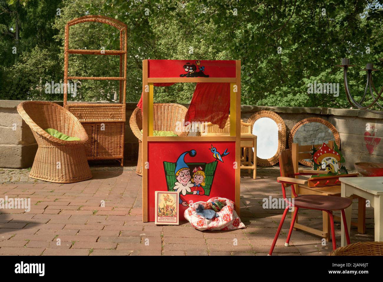 Rattan furniture and puppet theater at the flea market in Hanover Stock ...
