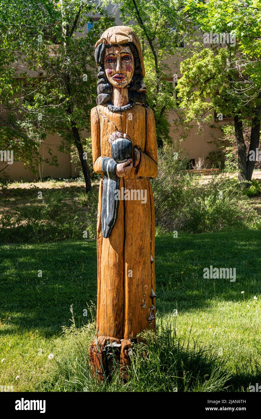 One of seven archangel statues carved from the trunk of a cottonwood ...