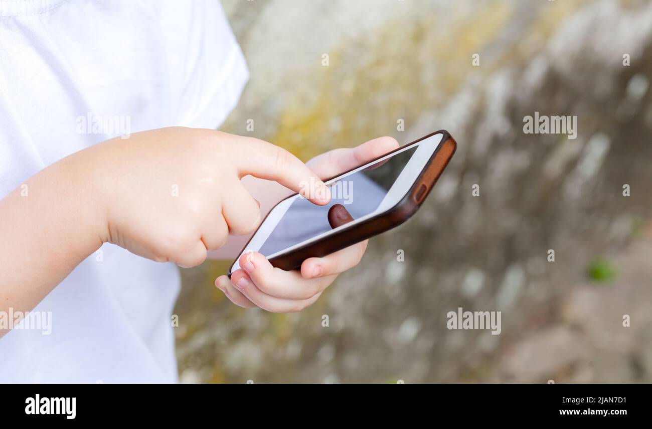 Anonymous school age girl, child using her mobile phone, smartphone ...