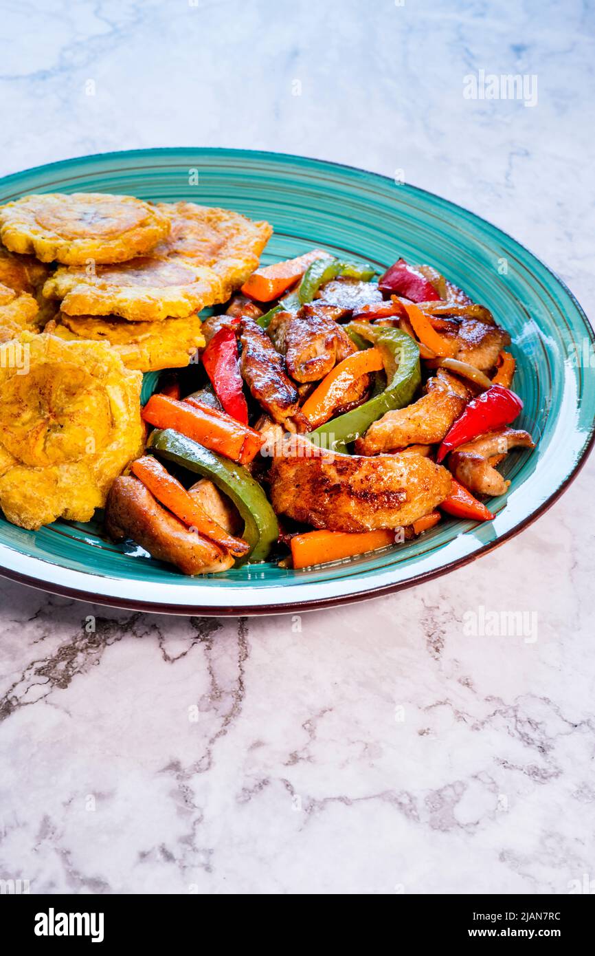 Chopped steak or Bistec Picao and patacones or tostones are fried green ...