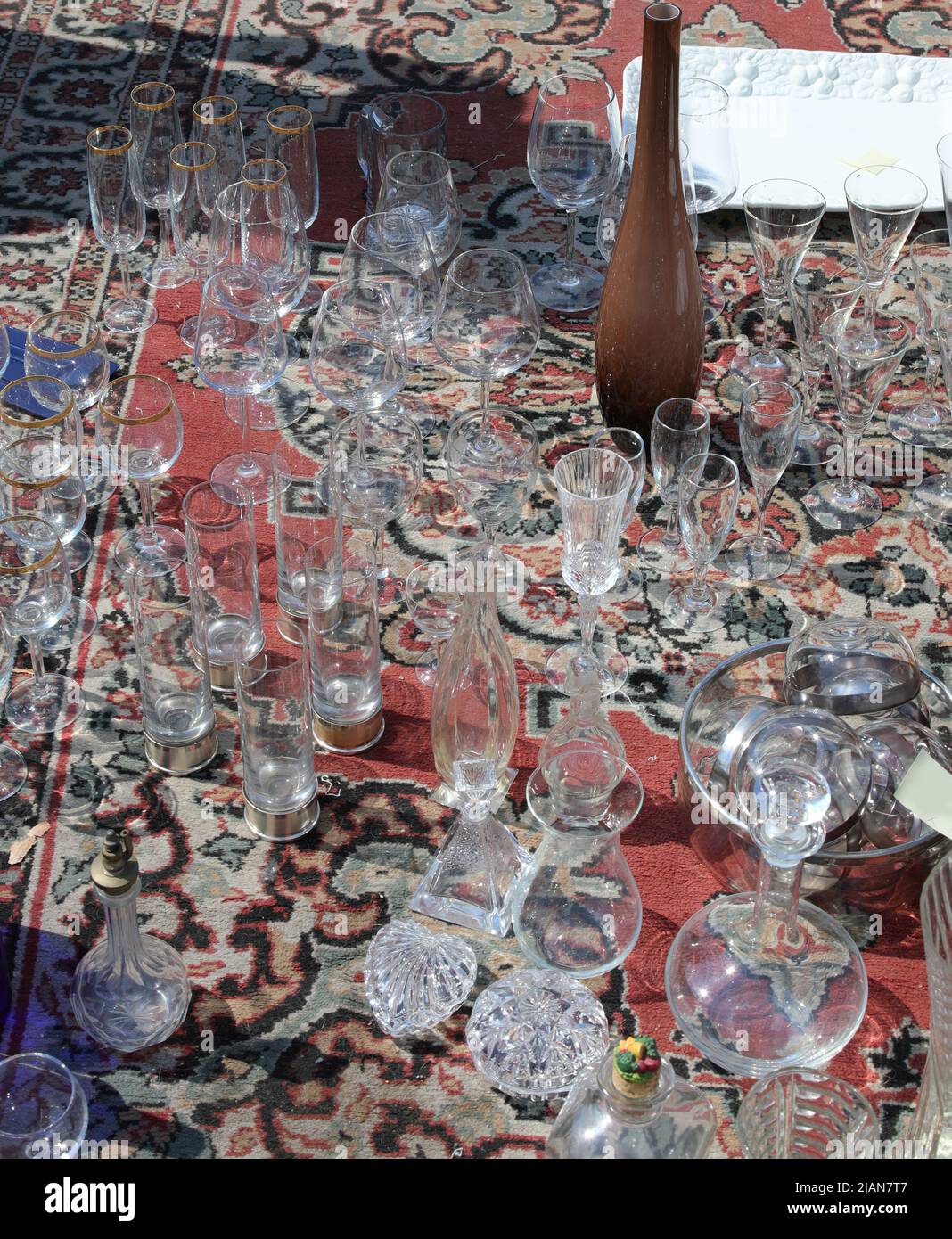 clearance sale of many fragile glasses in the flea market over an old ...