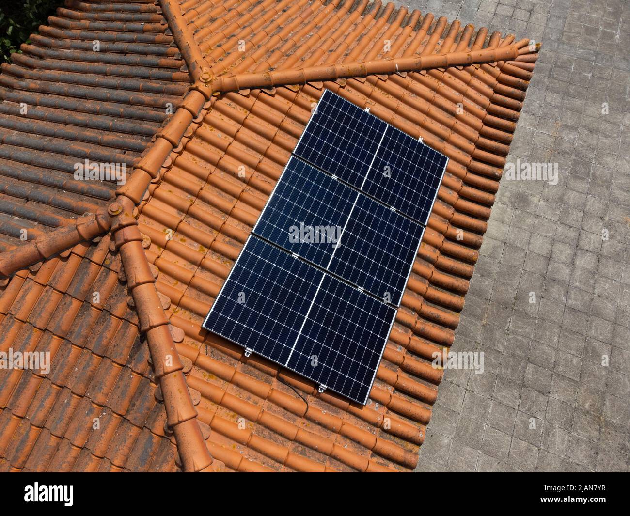 Three photovoltaic solar panels on the roof of a house Stock Photo - Alamy
