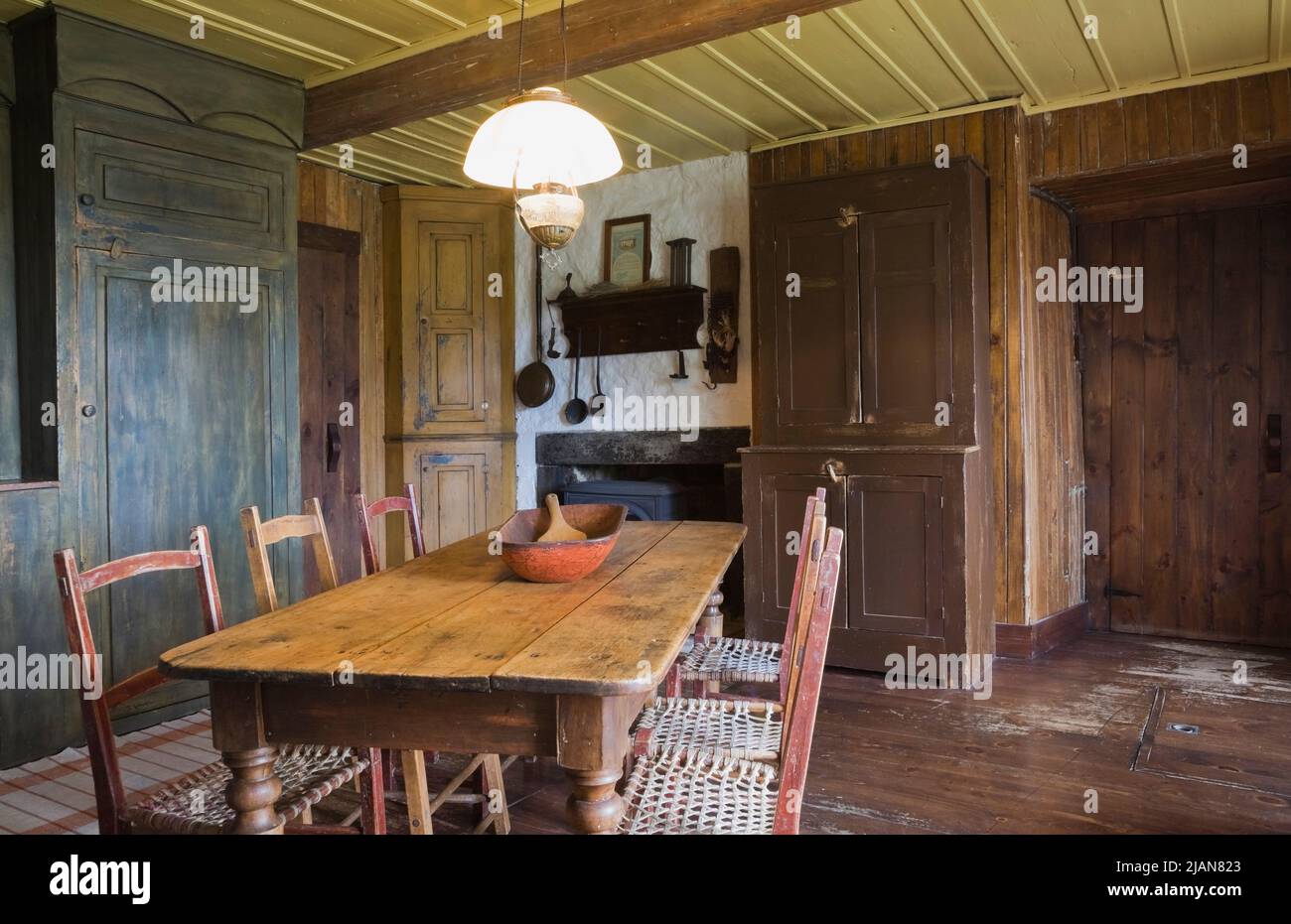 Antique wooden dining table and chairs in kitchen inside old circa 1840 ...