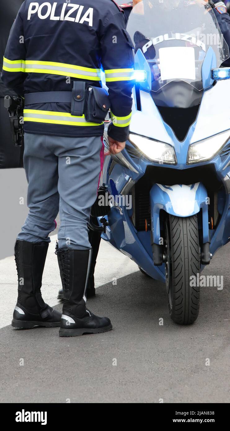 Italian Policeman with the uniform with the text POLIZIA which means ...