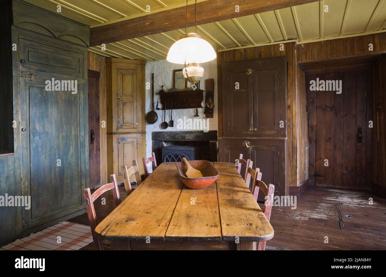Antique wooden dining table and chairs in kitchen inside old circa 1840 ...