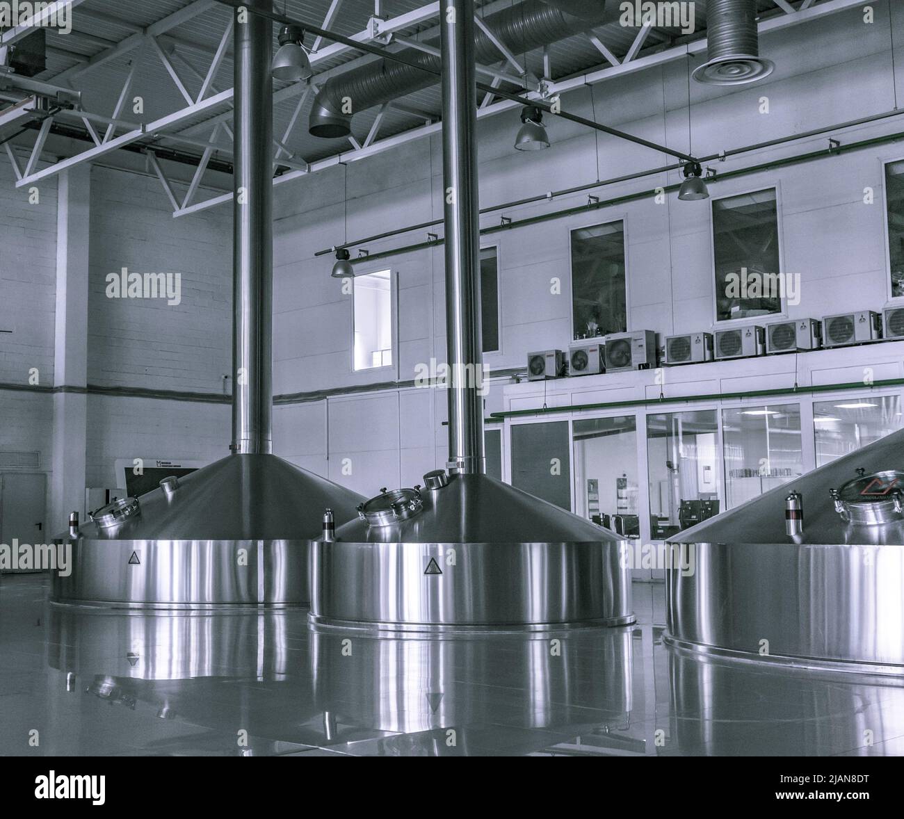 Modern interior of a beer factory mash vats metal containers Stock ...