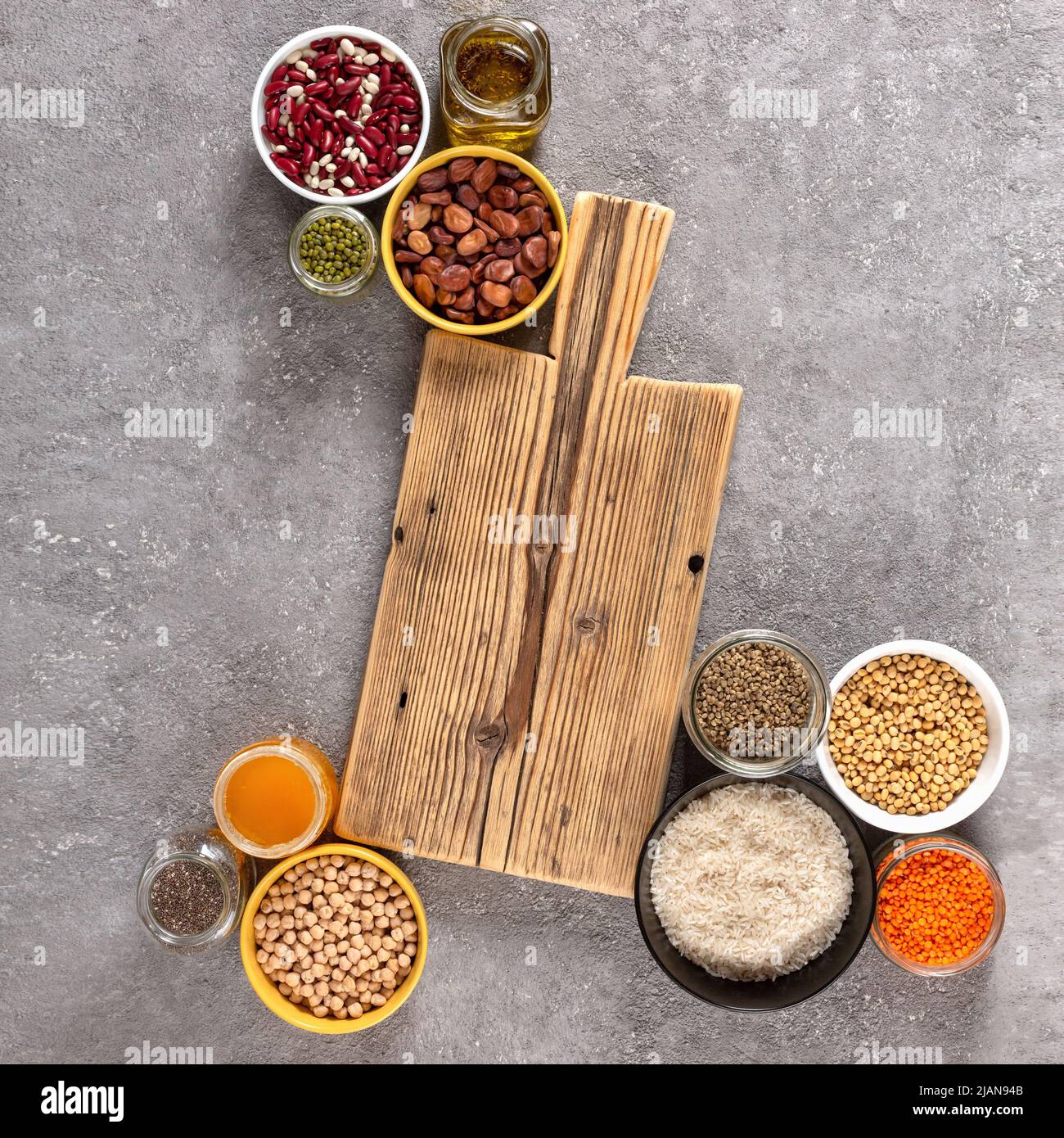Vegetarian food staple beans and seeds with empty cutting board Stock ...