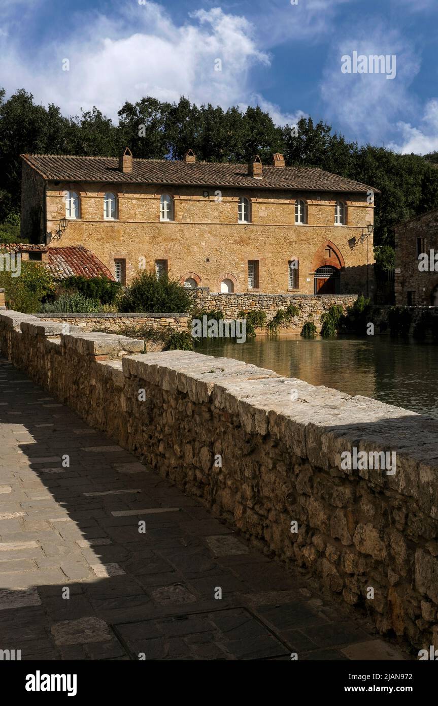Buildings in honey-coloured Tuscan stone surround the 16th century Bath ...