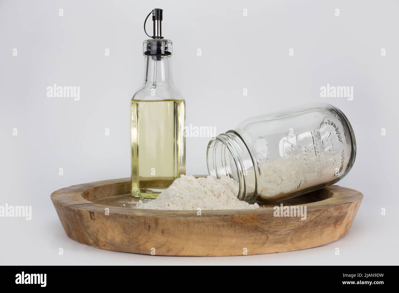 Oil bottle with flour Stock Photo - Alamy