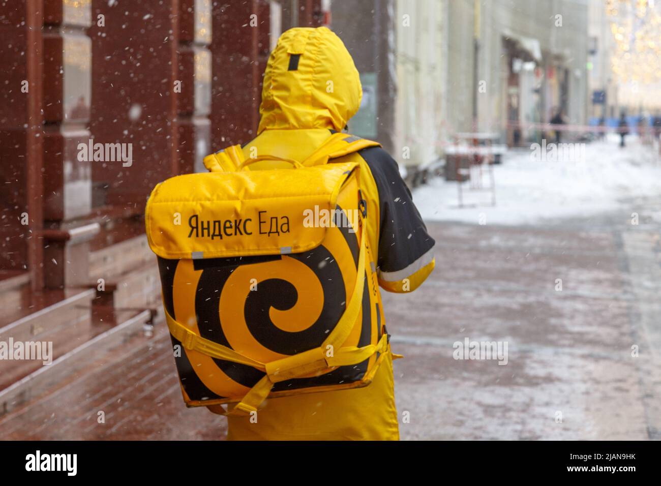 MOSCOW, RUSSIA - FEBRUARY 13,2019: A man from the delivery service of ...