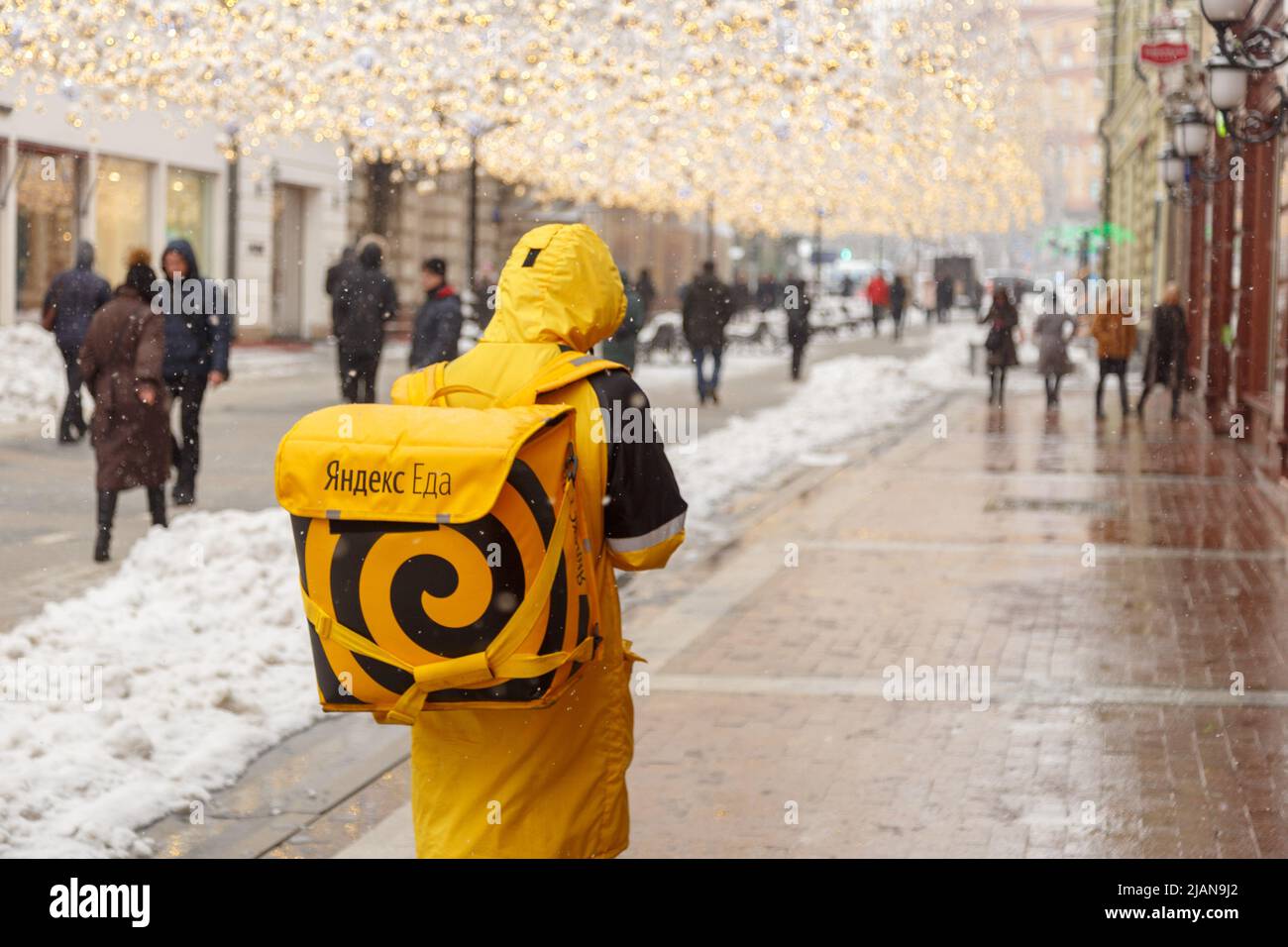 MOSCOW, RUSSIA - FEBRUARY 13,2019: A man from the delivery service of ...