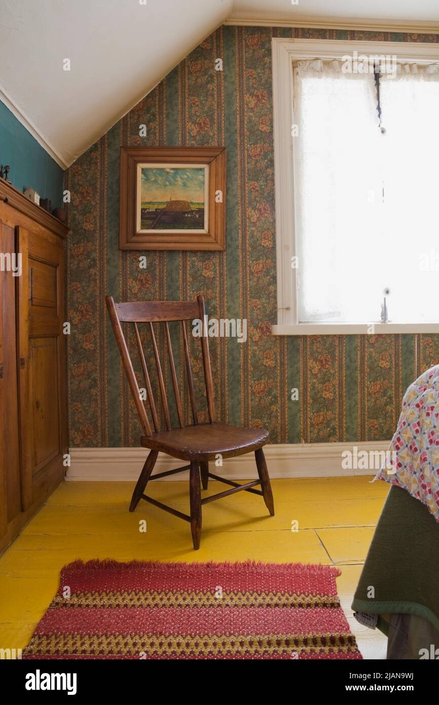 Antique chair and furnishings in main bedroom on upstairs floor inside ...