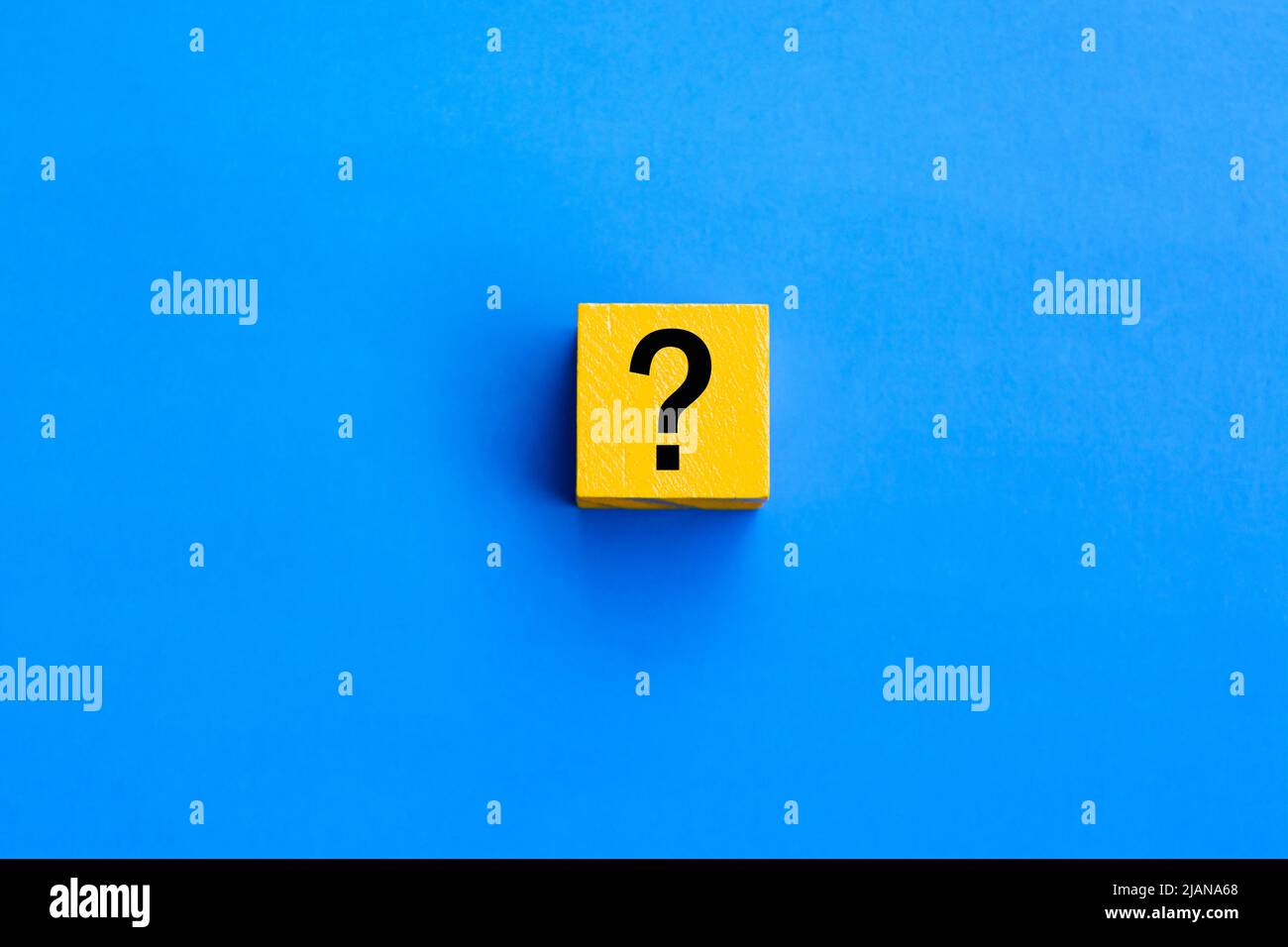 Cube with question mark on blue background. Question and answer concept ...