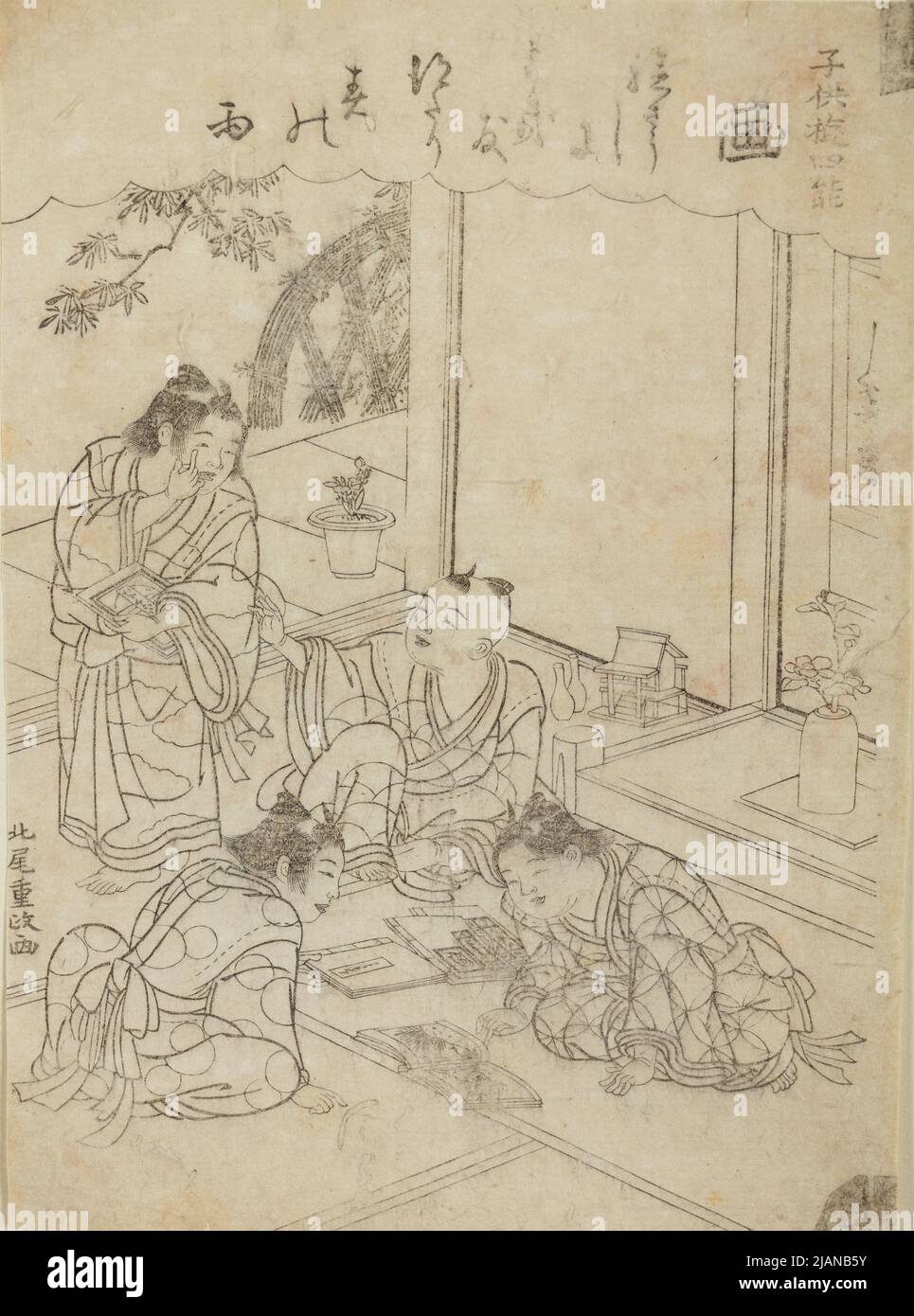 Four boys watchinglooking at illustrations in books and talking ...