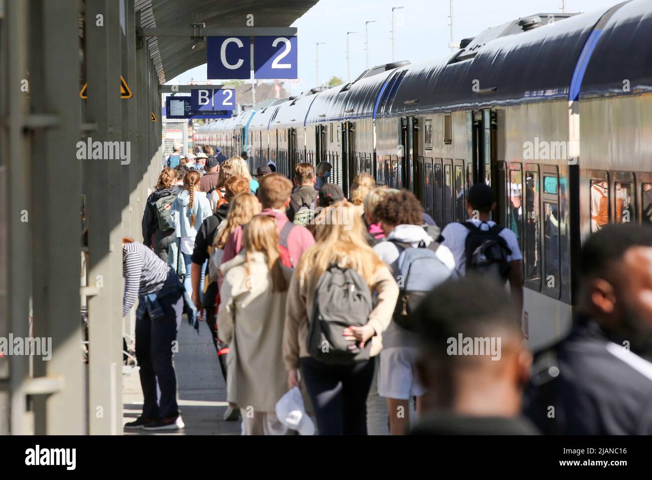 Westerland, Germany. 31st May, 2022. Travelers board a train on the RE6 ...