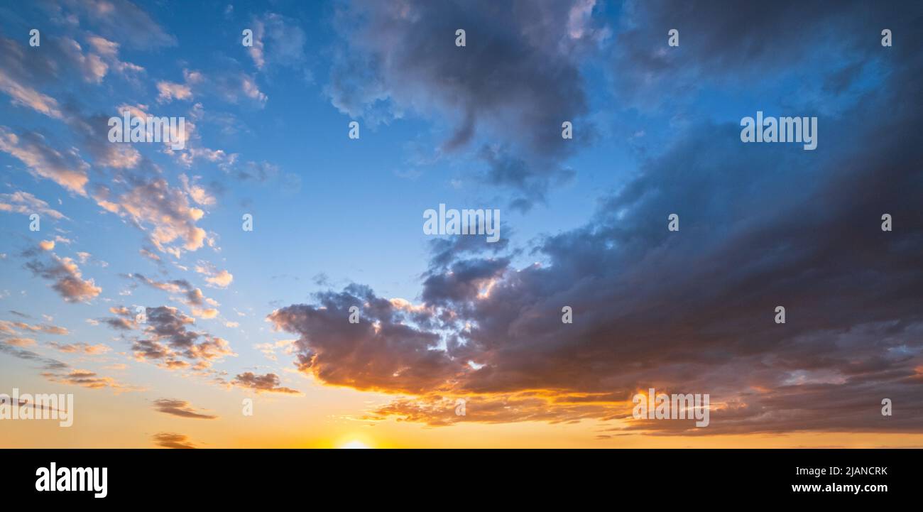 Clouds in evening dusk sky panoramic view. Climate, environment and ...