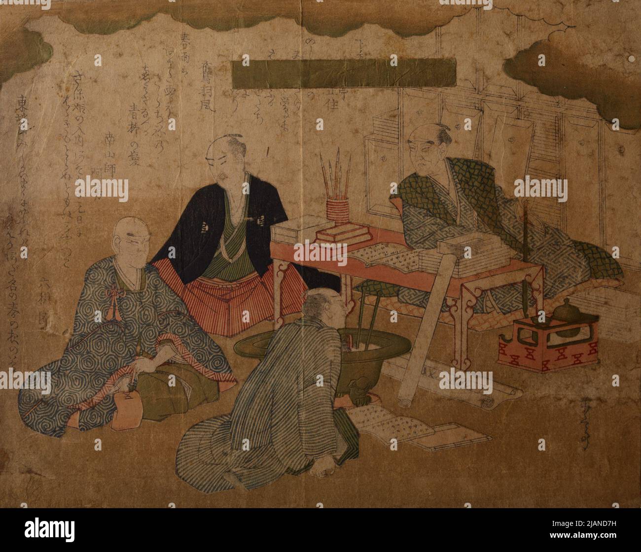 Four men around a table with books unknown Stock Photo - Alamy