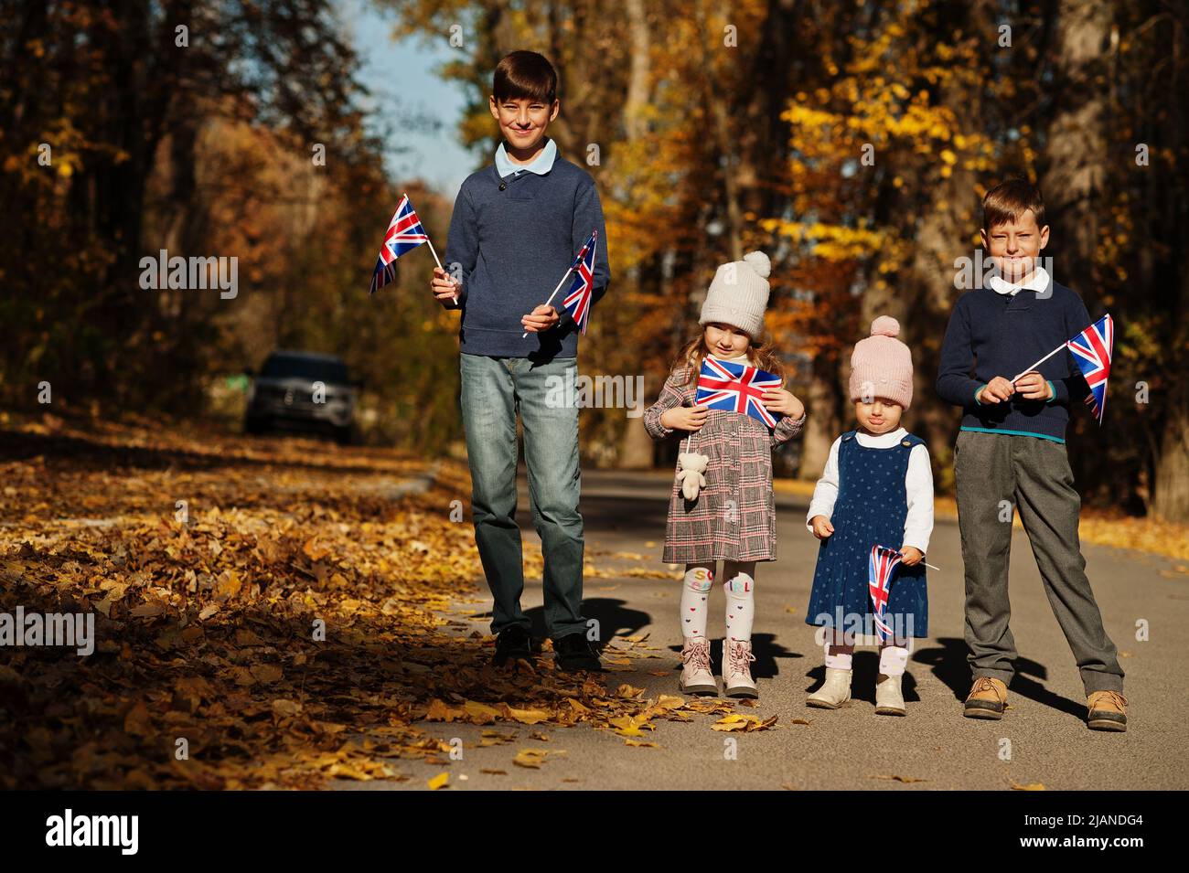 National holiday of United Kingdom. Four kids with british flags in ...