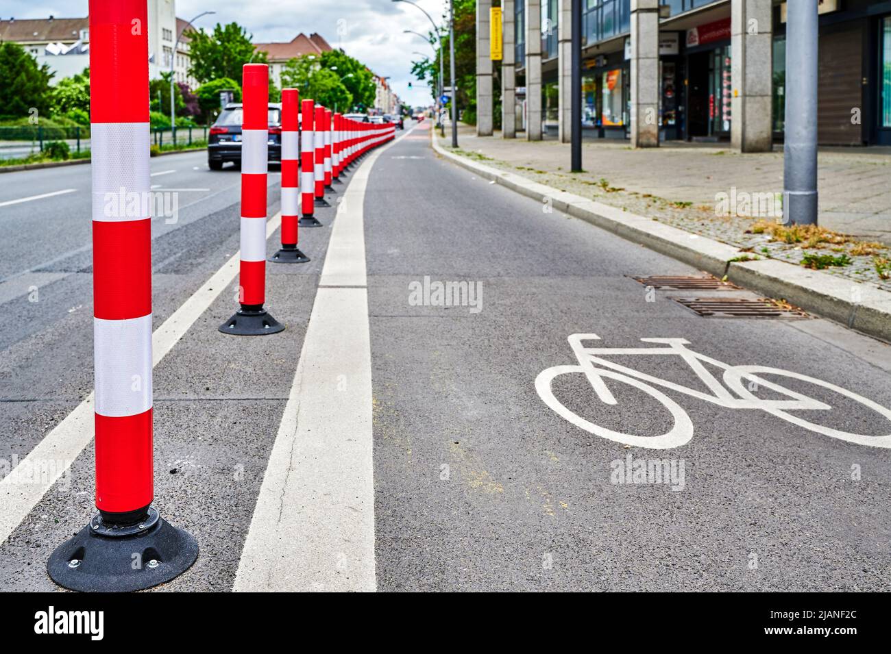 Separated bike lane on a main street in Berlin to improve road safety ...