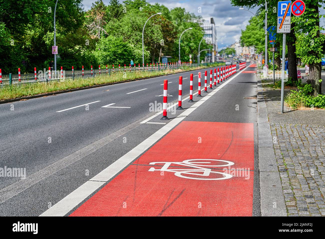 Separated bike lane on a main street in Berlin to improve road safety ...
