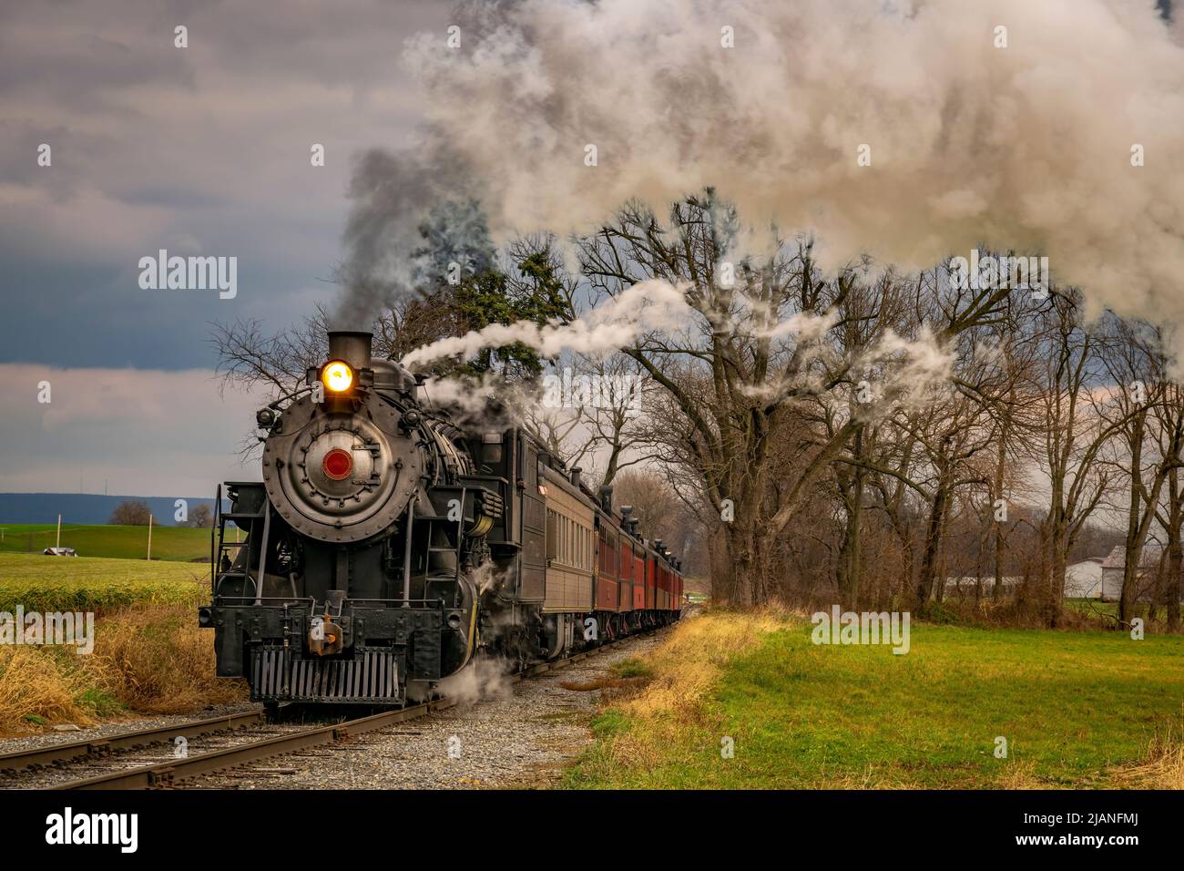 A View of an Antique Freight Steam Train Blowing Smoke Approaching Thru ...