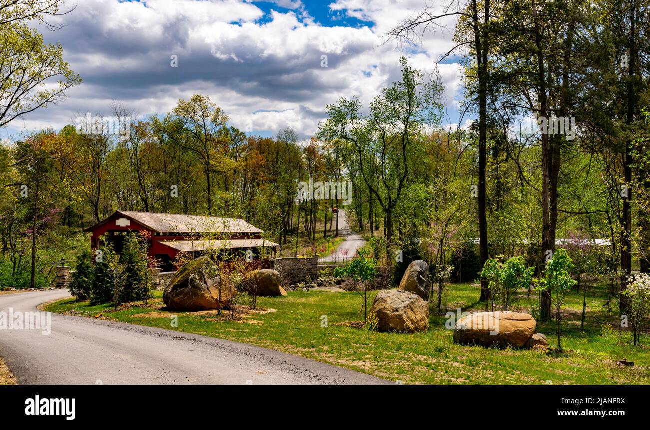 View of a Country Road Approaching to a Restored Covered Bridge on a ...