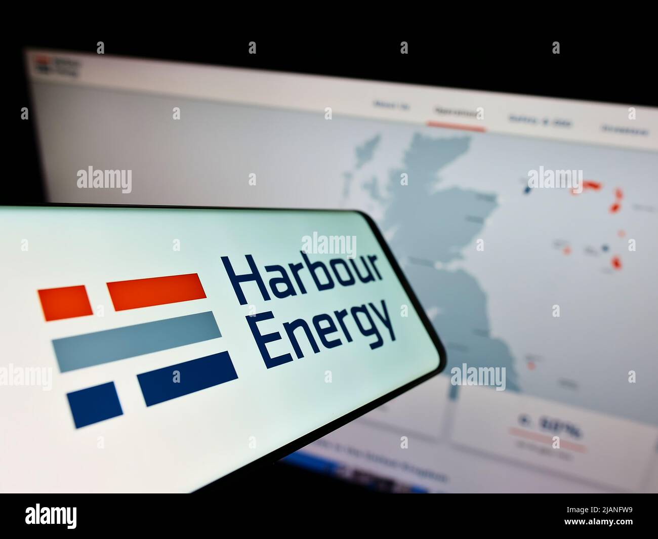 Smartphone with logo of British oil and gas company Harbour Energy plc ...