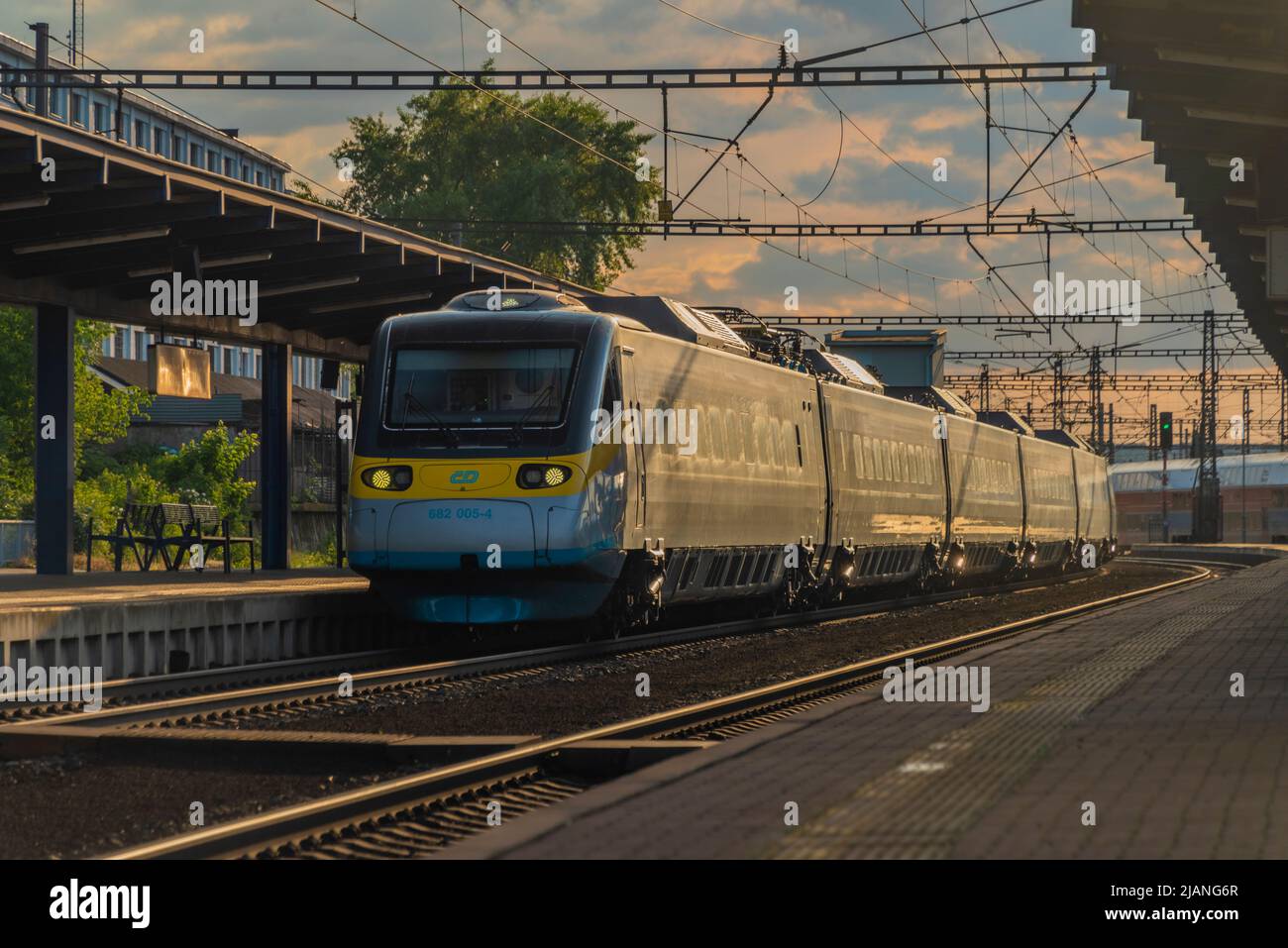 High speed train in Praha Liben station in spring sunny fresh evening ...