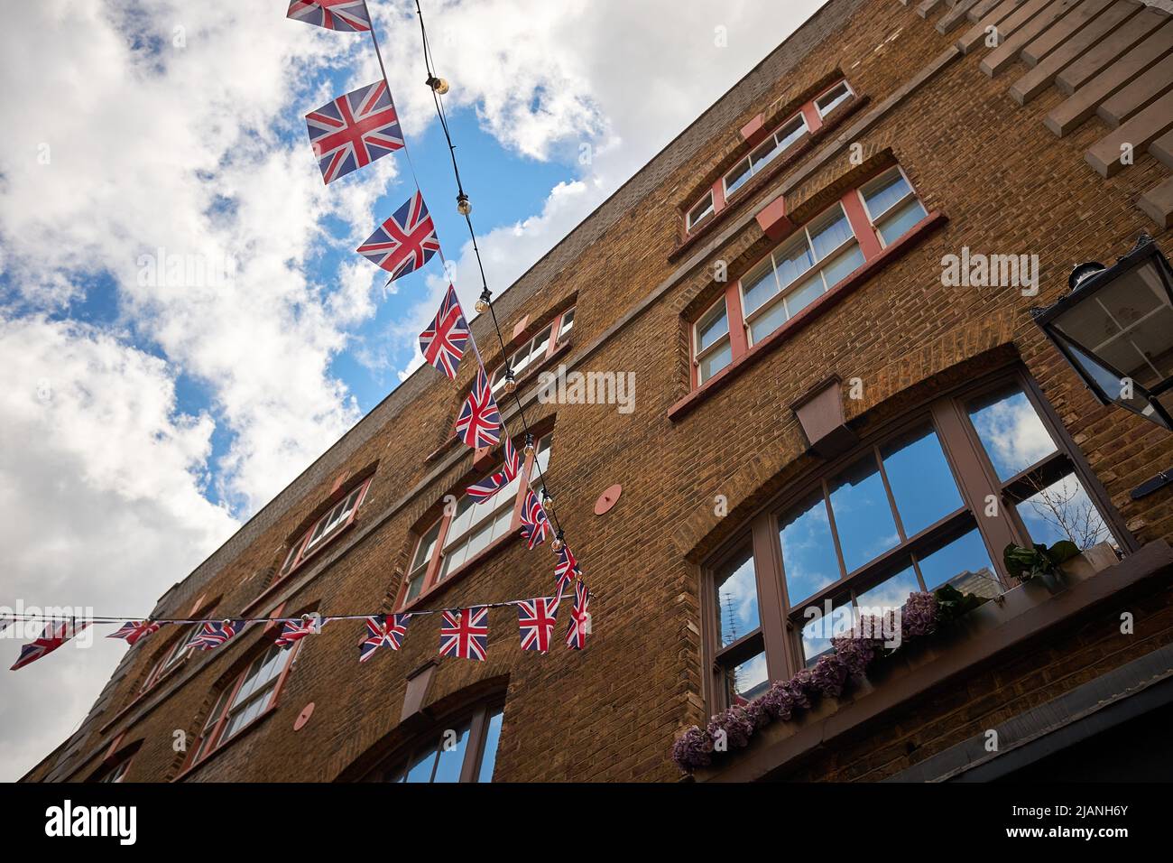 Union Jack flags strung across a building in London for the Queen's ...