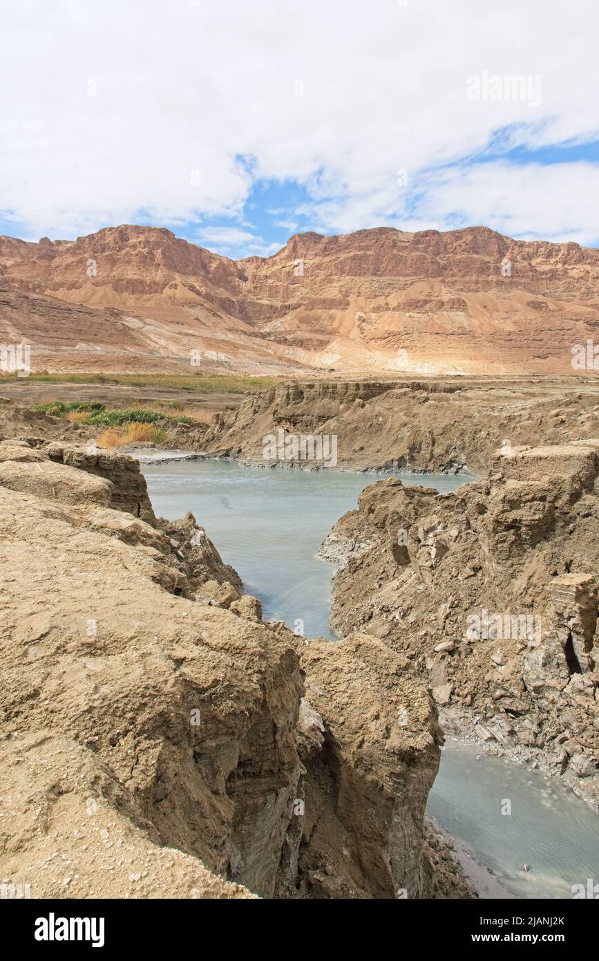 Sinkhole filled with turquoise water, near Dead Sea coastline. Hole ...