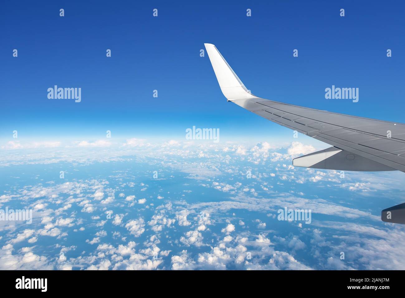 View of the plane wing from the window of passenger seat Stock Photo ...