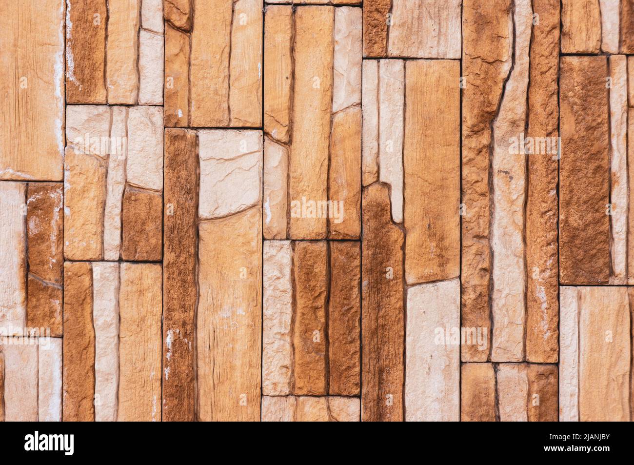 Rock stone brick tile wall has a detailed background texture sepia ...