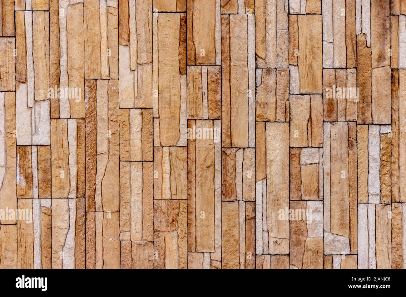 Rock stone brick tile wall has a detailed background texture sepia ...