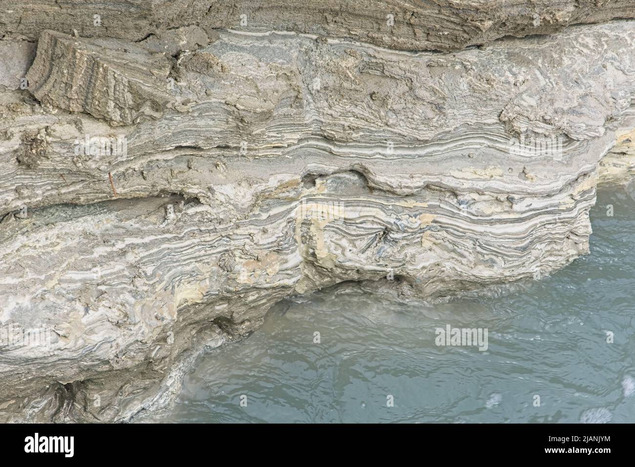 Sinkhole filled with turquoise water, near Dead Sea coastline. Leyers ...