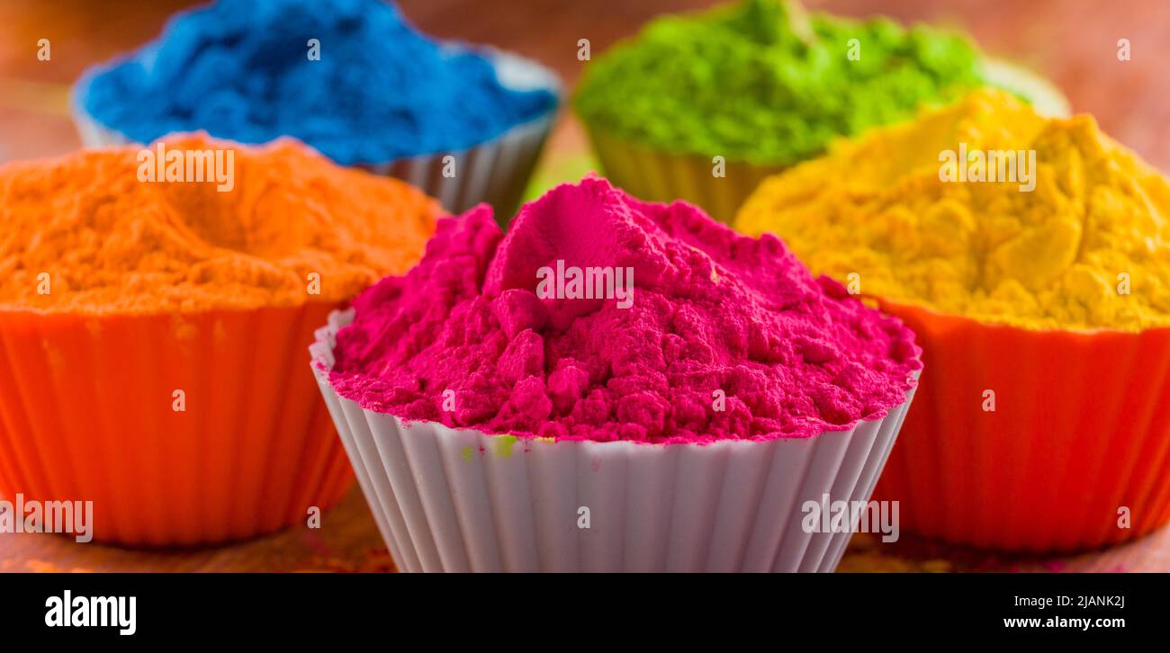 Vivid colorful Holi dye powder in cups. Shallow depth of field Stock ...